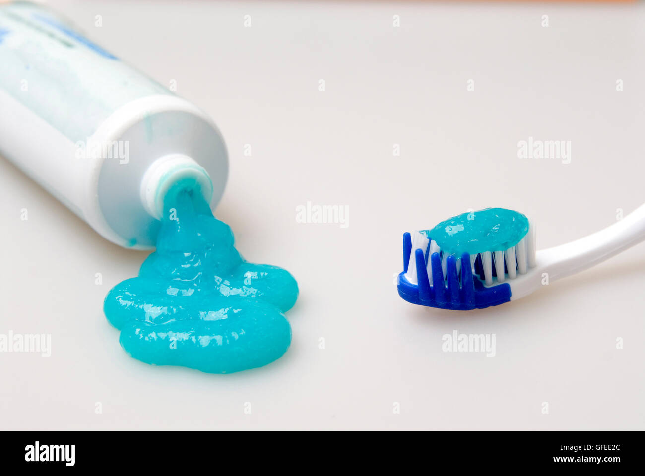Toothpaste and tooth brush on white background Stock Photo - Alamy