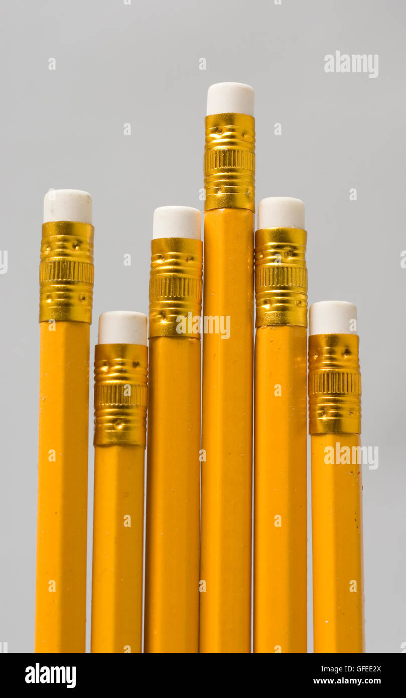 6 yellow pencils of different lengths Stock Photo - Alamy
