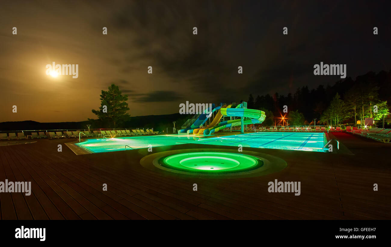 resort pool at night Stock Photo - Alamy