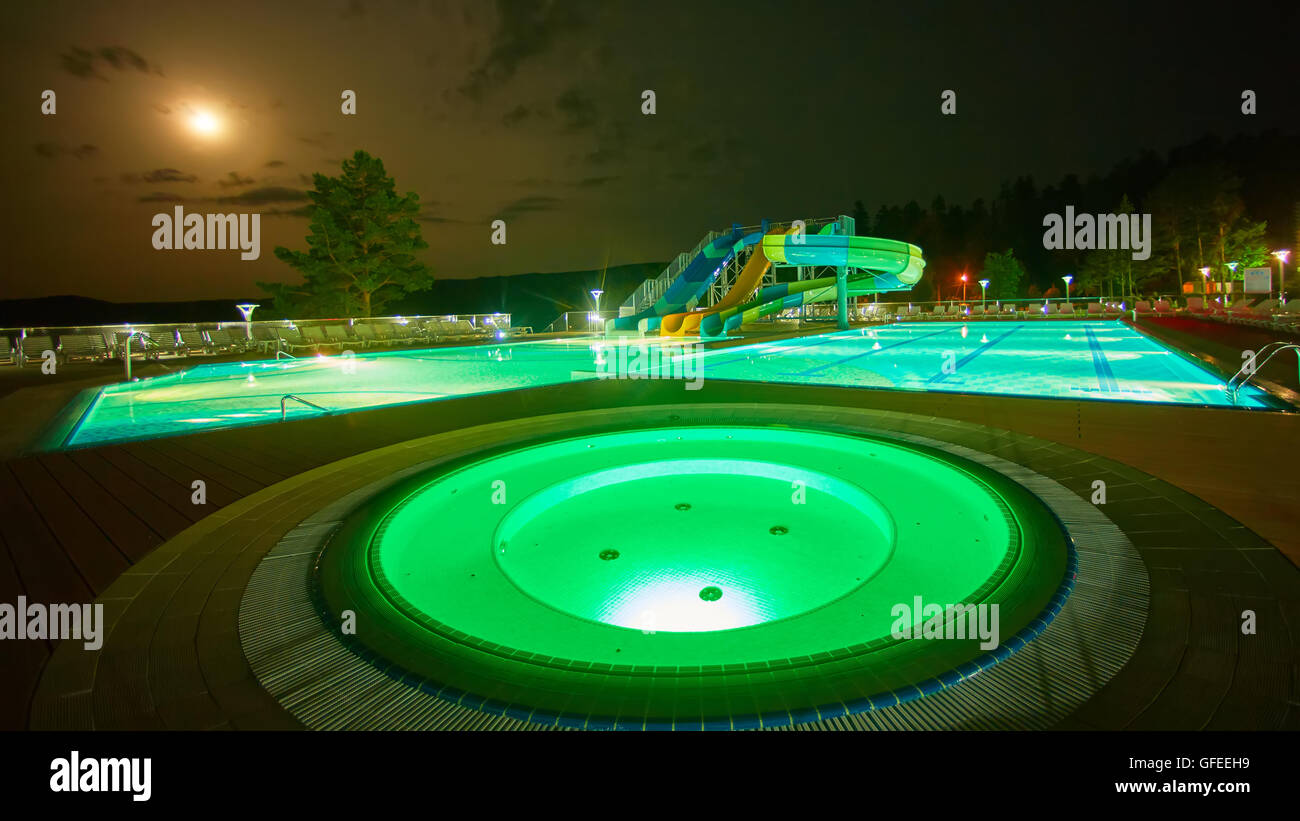 resort pool at night Stock Photo - Alamy