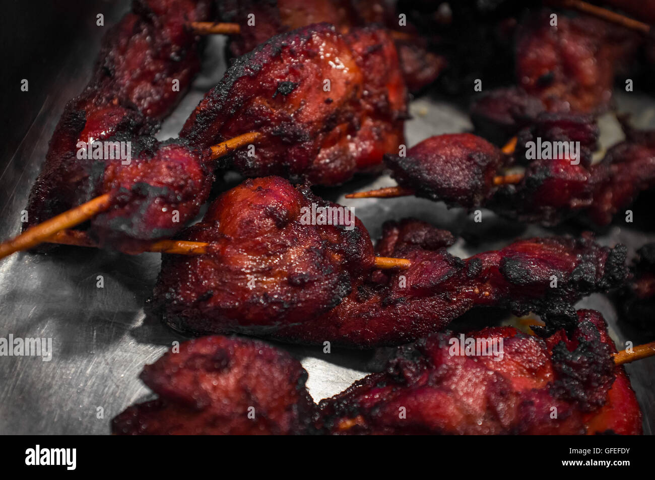 Restaurant style Chinese red chicken kebabs on serving tray Stock Photo ...