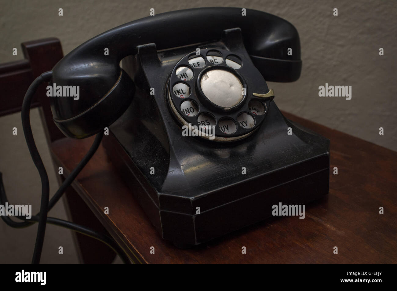 Old vintage rotary dial telephone on wooden desk Stock Photo - Alamy