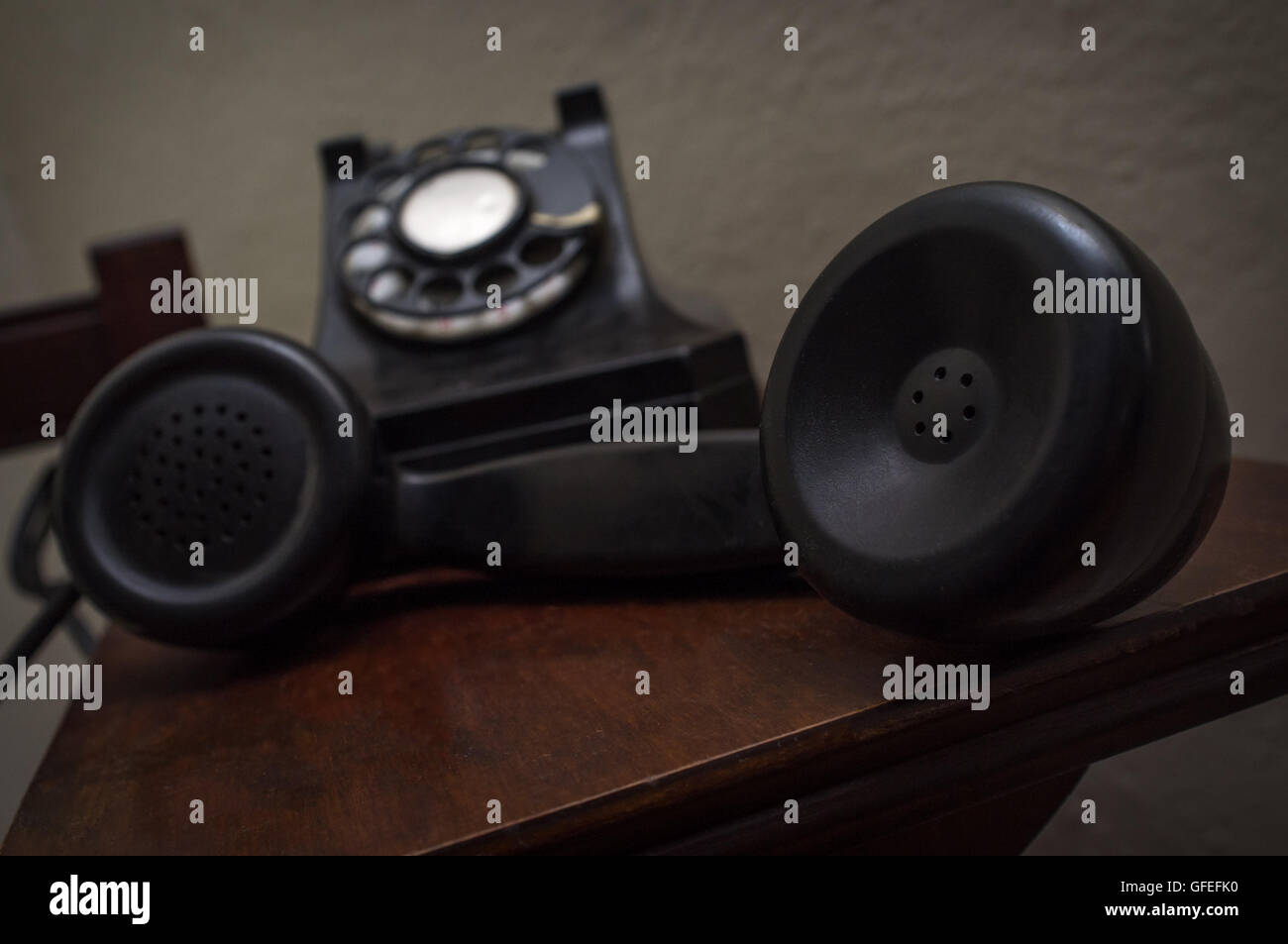 Old vintage rotary dial telephone on wooden desk Stock Photo - Alamy