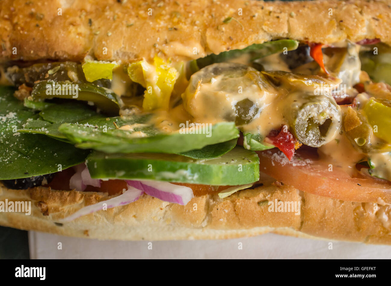 Stuffed overflowing huge spicy sub sandwich with every topping Stock ...