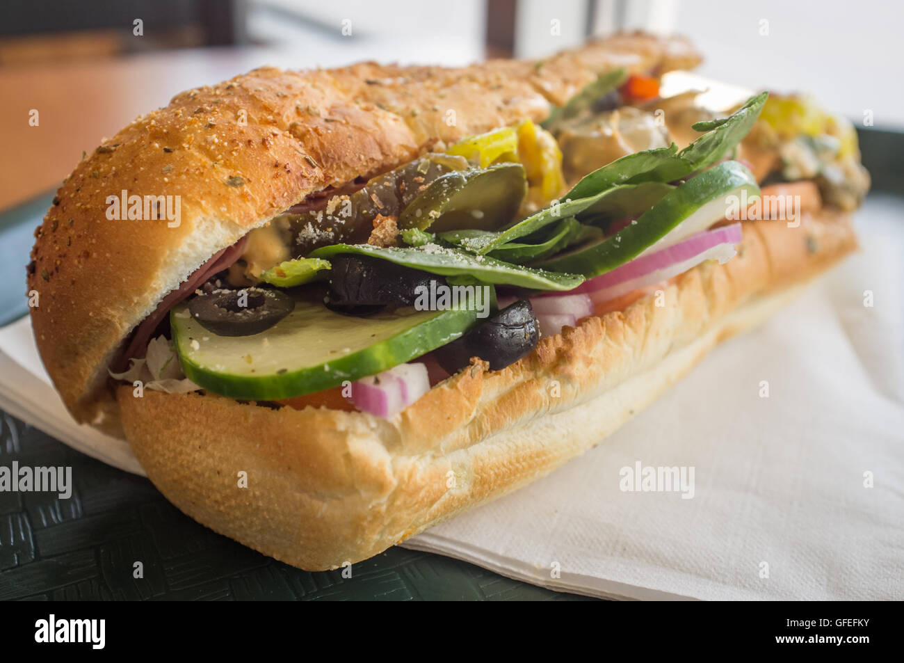 Stuffed overflowing huge spicy sub sandwich with every topping Stock ...