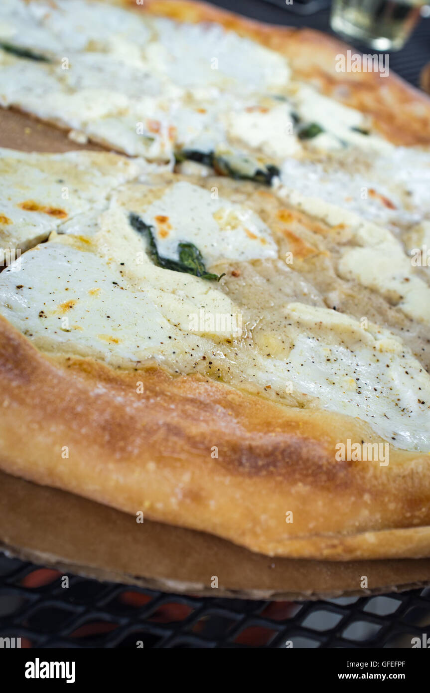 Large slices of white cheese pizza New York style Stock Photo - Alamy