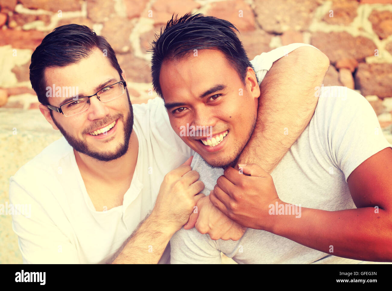 Two young friends smiling Stock Photo - Alamy