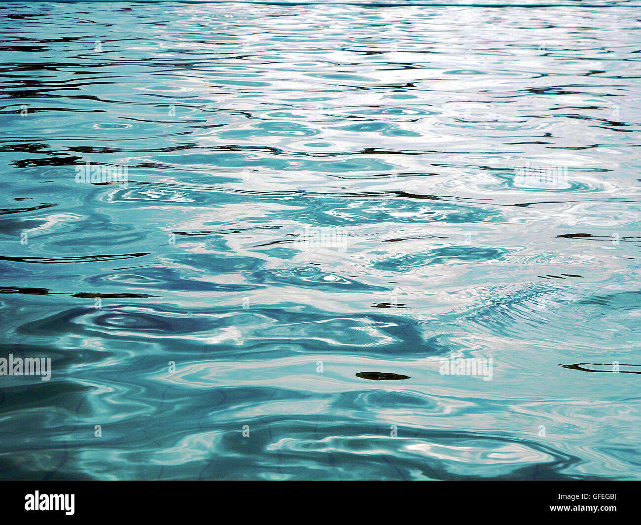 reflection of light on the waves ,blue water and light from the sun in ...