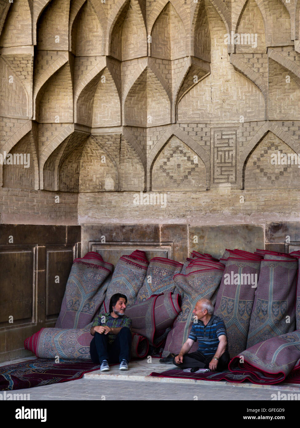 Two men having a friendly chat in Jame mosque, Isfahan, Iran Stock ...