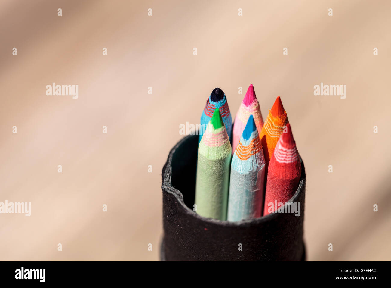Macro view of orange, blue, red, green and pink colored pencils with a ...