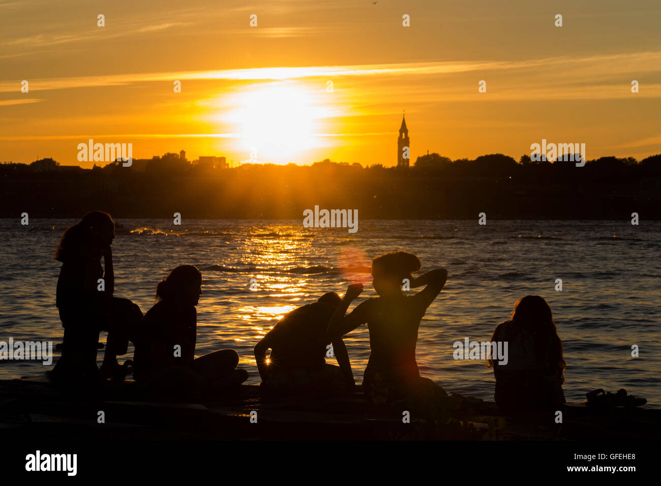 Children's playing in sunset, port of Montreal, Canada Stock Photo - Alamy