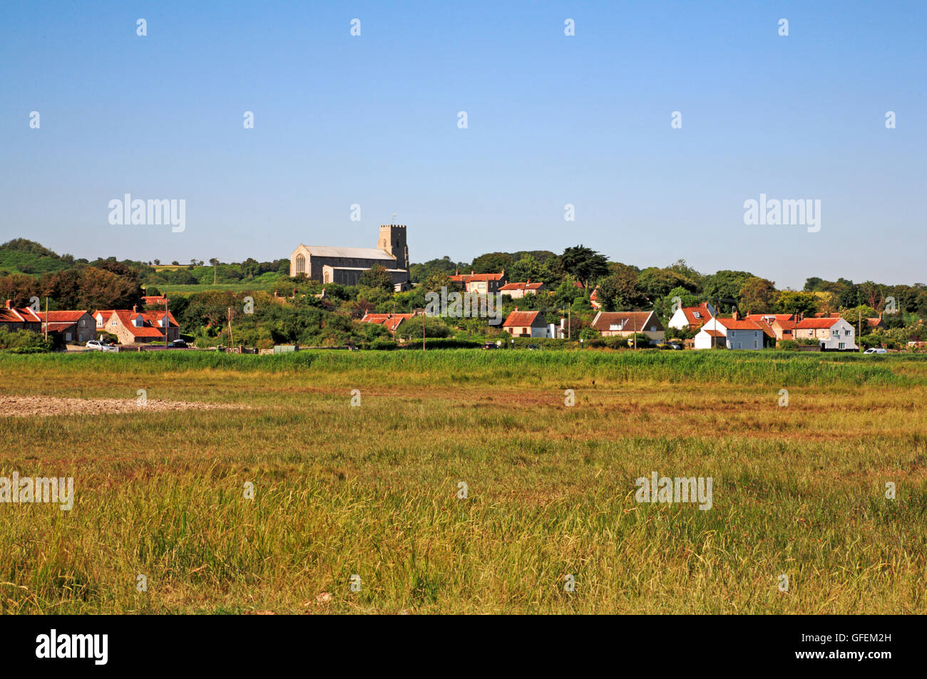 A view of Salthouse from the salt marshes on the coast of North Norfolk ...