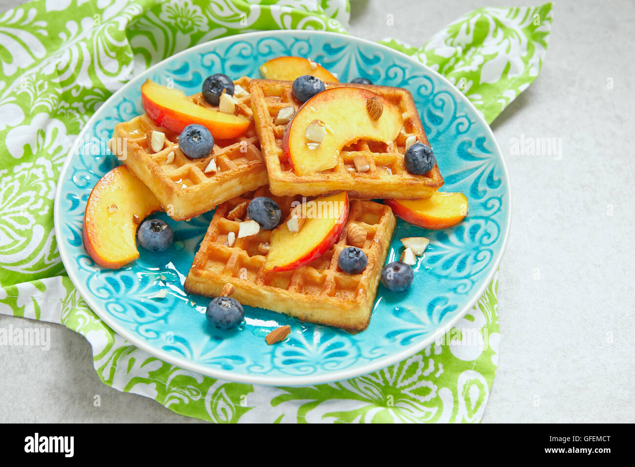 Plate of belgian waffles with fresh fruits and berries Stock Photo - Alamy