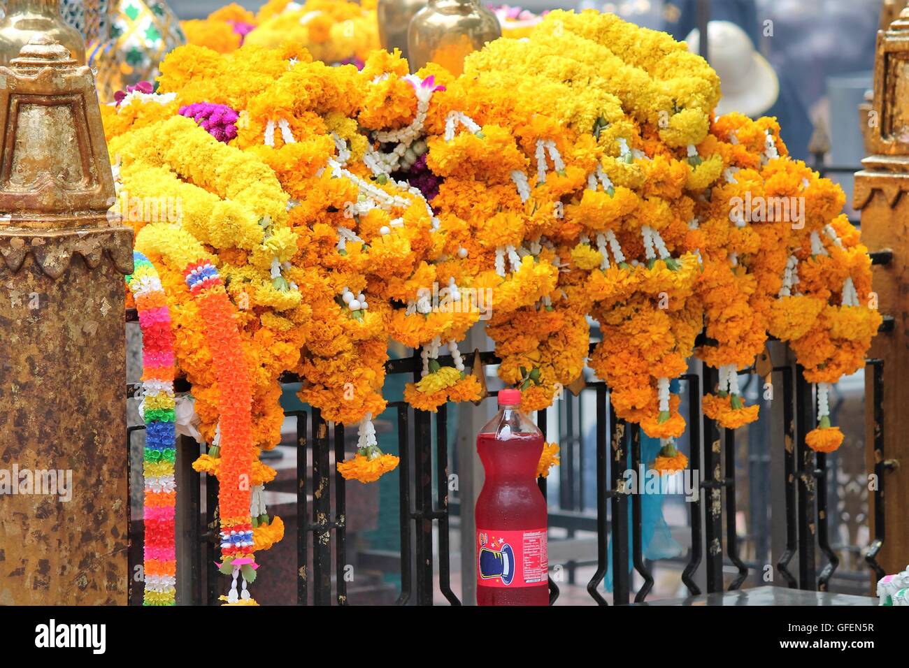 flower offering at a Hindu temple in Thailand offering flower garlands ...
