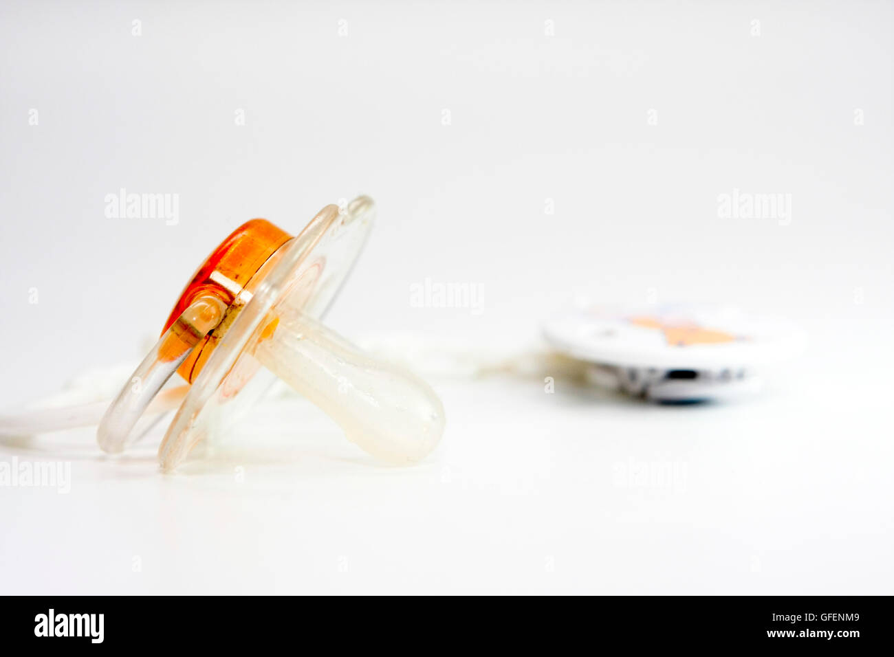Baby's pacifier on white background Stock Photo - Alamy