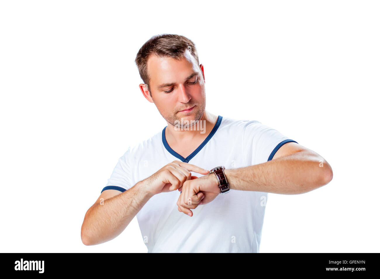 Worrier man running out of time looking his watch isolated on a white ...