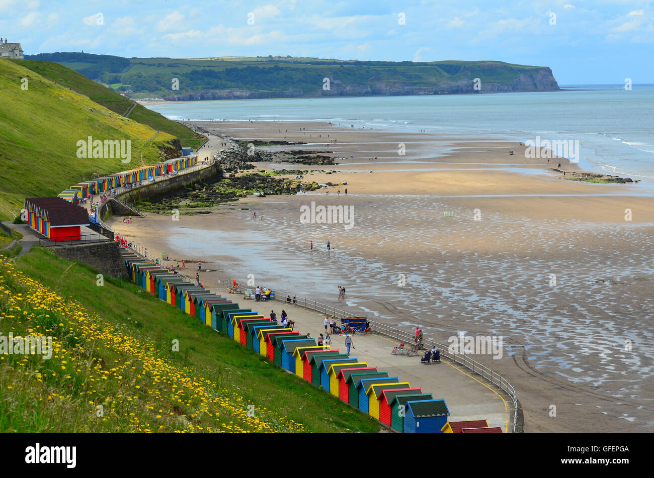 Multi-coloured beach huts at Whitby Beach, Whitby, Yorkshire, England ...