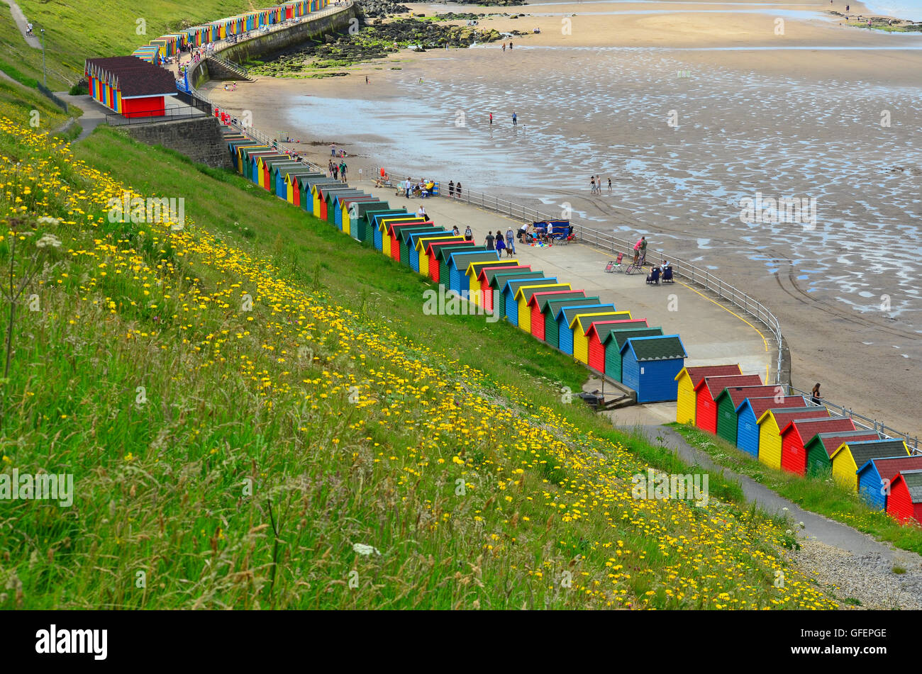 Multi-coloured beach huts at Whitby Beach, Whitby, Yorkshire, England ...