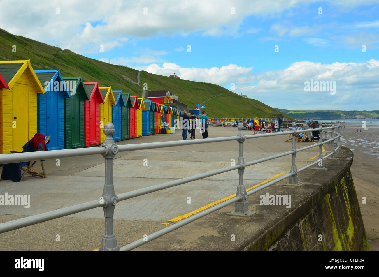 Multi-coloured beach huts at Whitby Beach, Whitby, Yorkshire, England ...