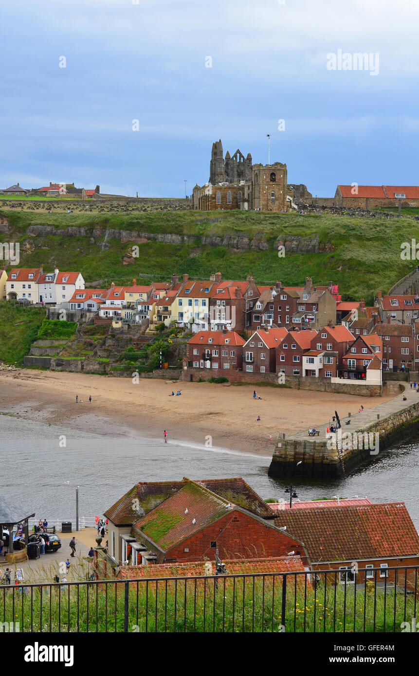 A view of Whitby Pier and harbour looking across rooftops in The North ...