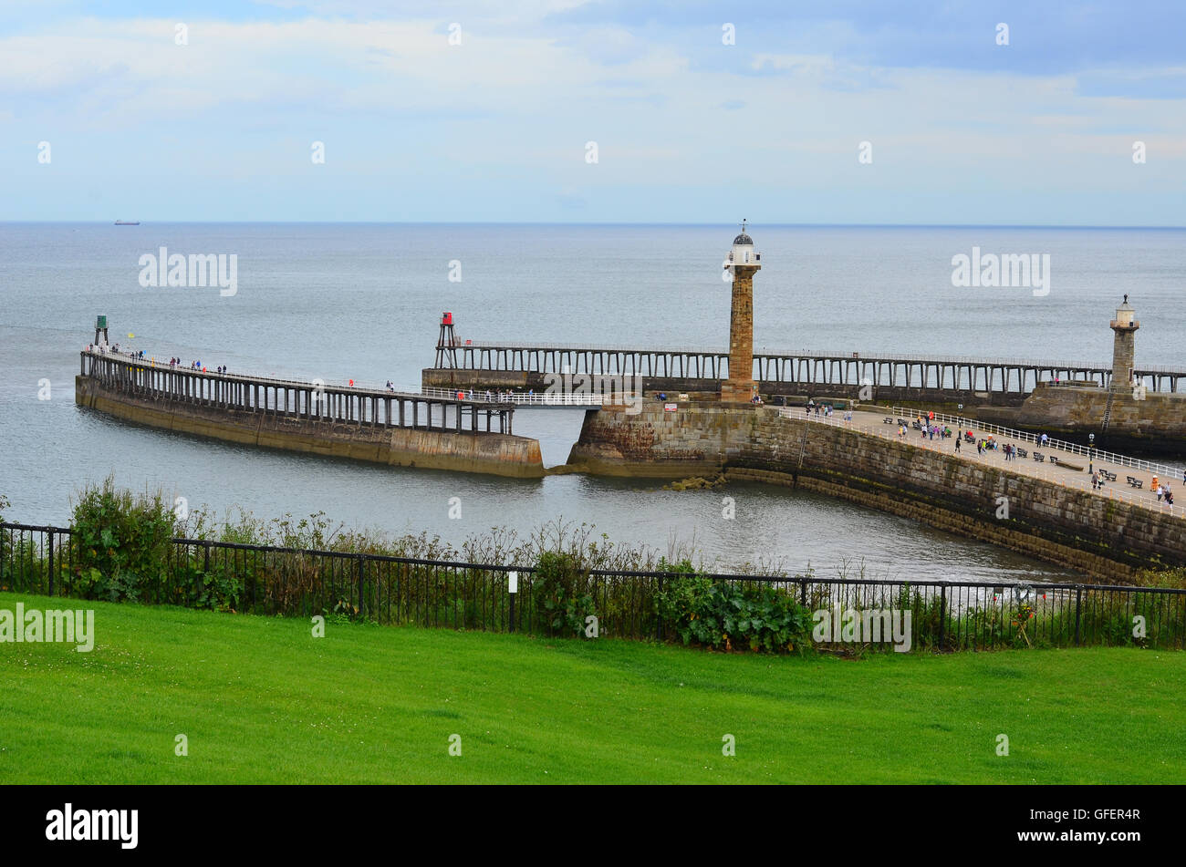 A view of Whitby Pier and harbour looking across rooftops in The North ...
