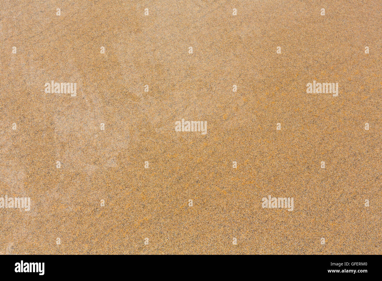 Wet yellow sand background with sky reflection Stock Photo - Alamy