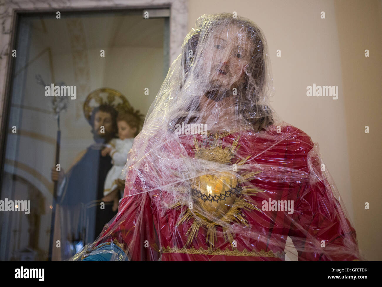 A stature of Jesus is wrapped in cling film at Mother Church of "St ...