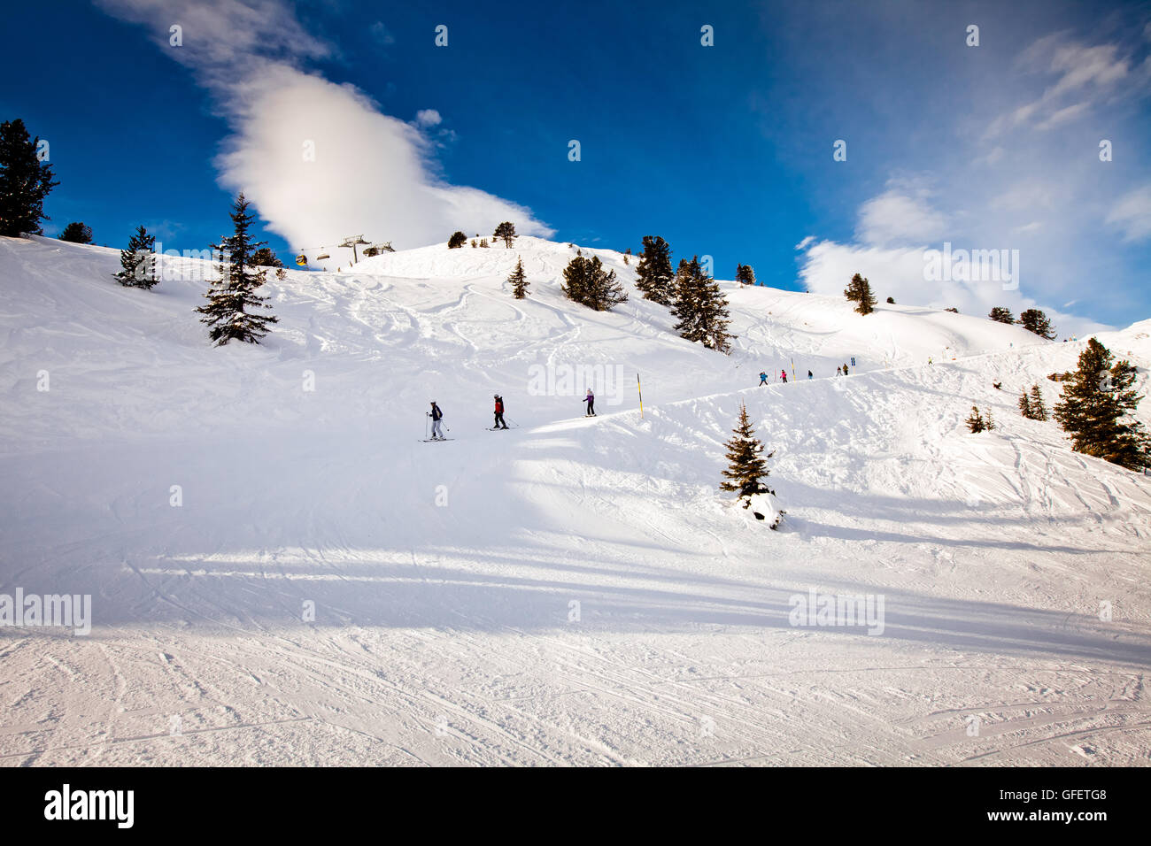 Ski resort in the Alps, people skiing Stock Photo - Alamy