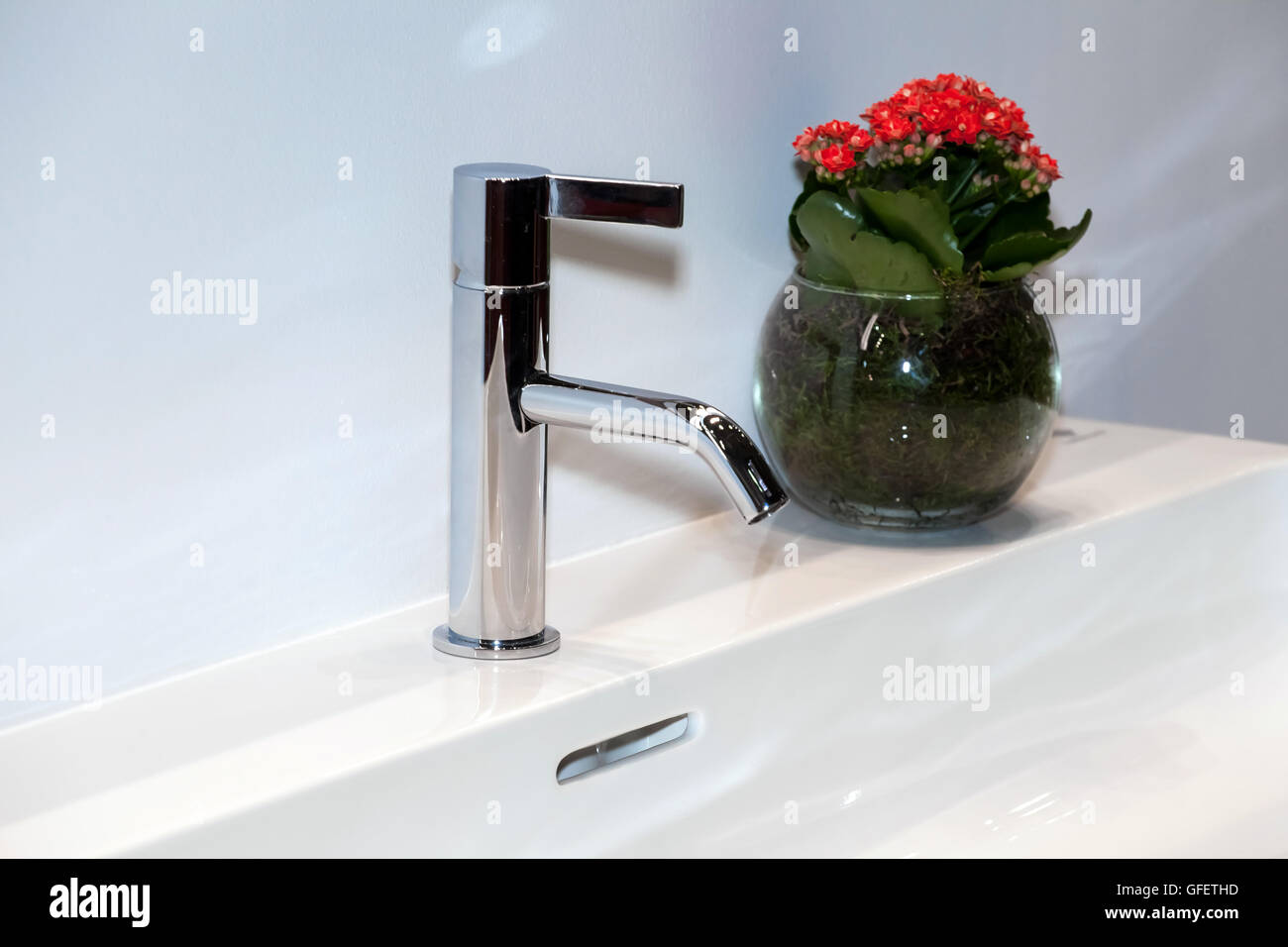 Modern chrome faucet in bathroom Stock Photo - Alamy
