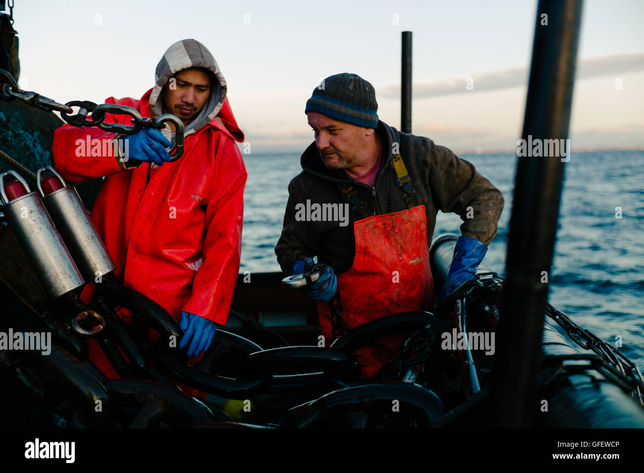 Fishermen working on a prawn trawler off the west coast of Scotland ...