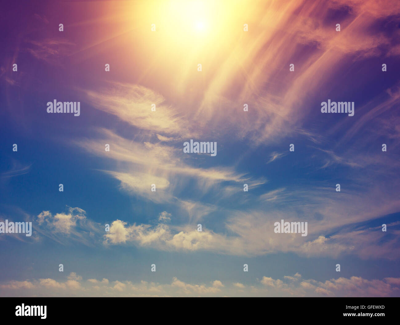 Colorful sky with light clouds and sun Stock Photo - Alamy