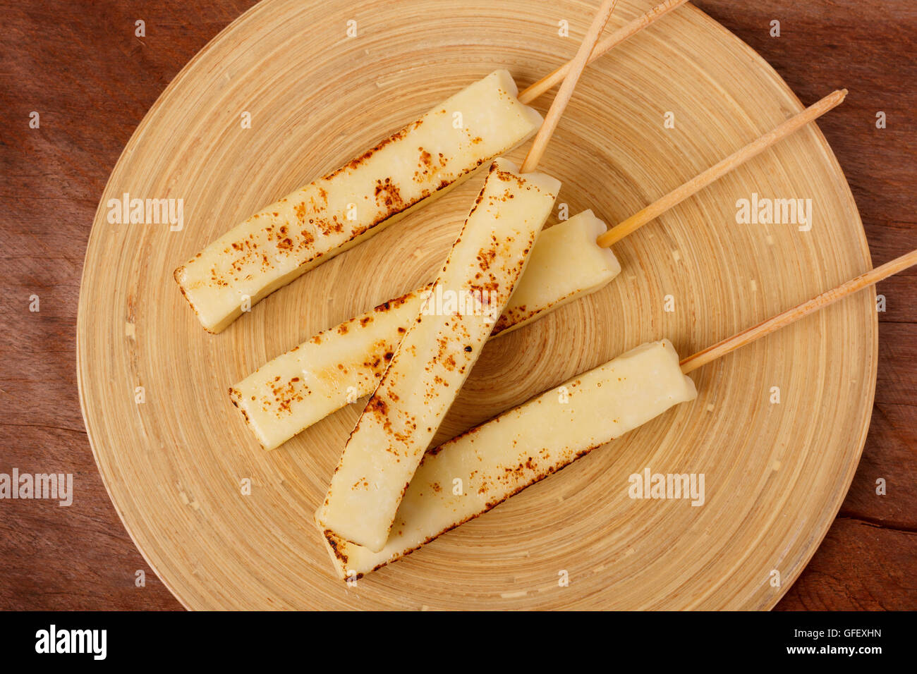 Brazilian traditional cheese queijo coalho on wooden board. Selective ...
