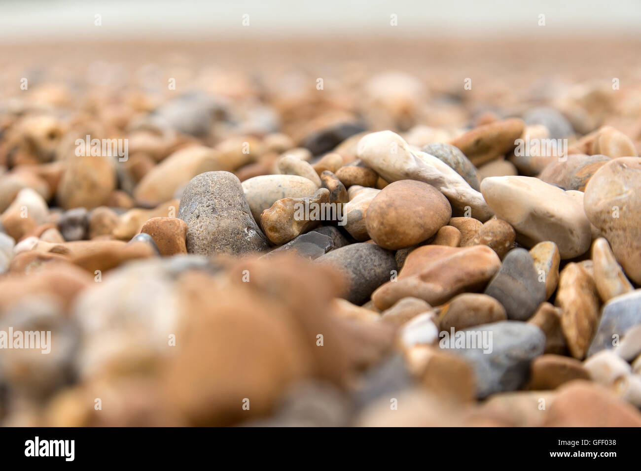 Soft focus of pebbles on a stormy, stony seaside beach in Brighton ...