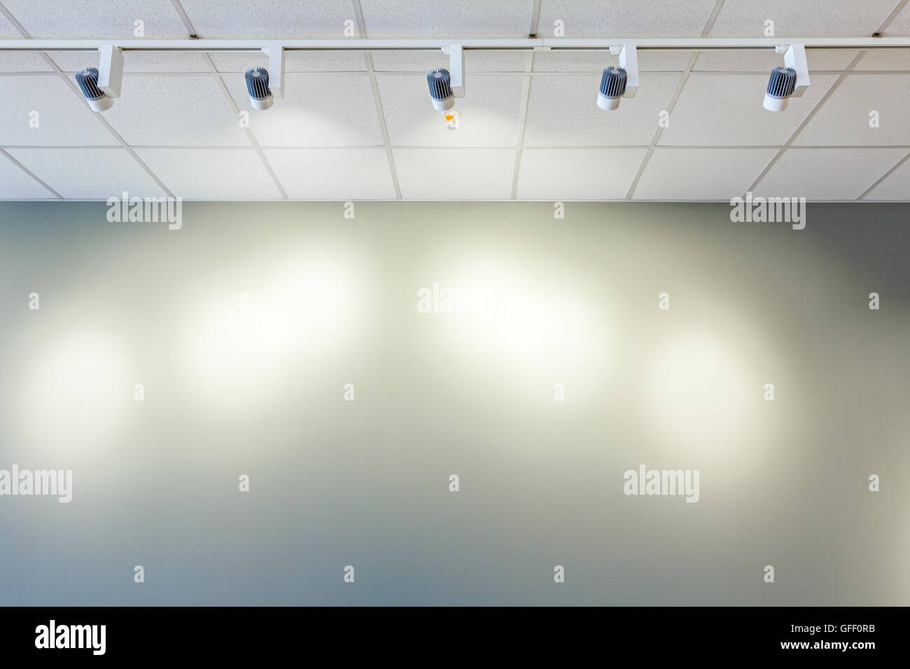 Light on the wall is coming out from floodlight ceiling light in a ...