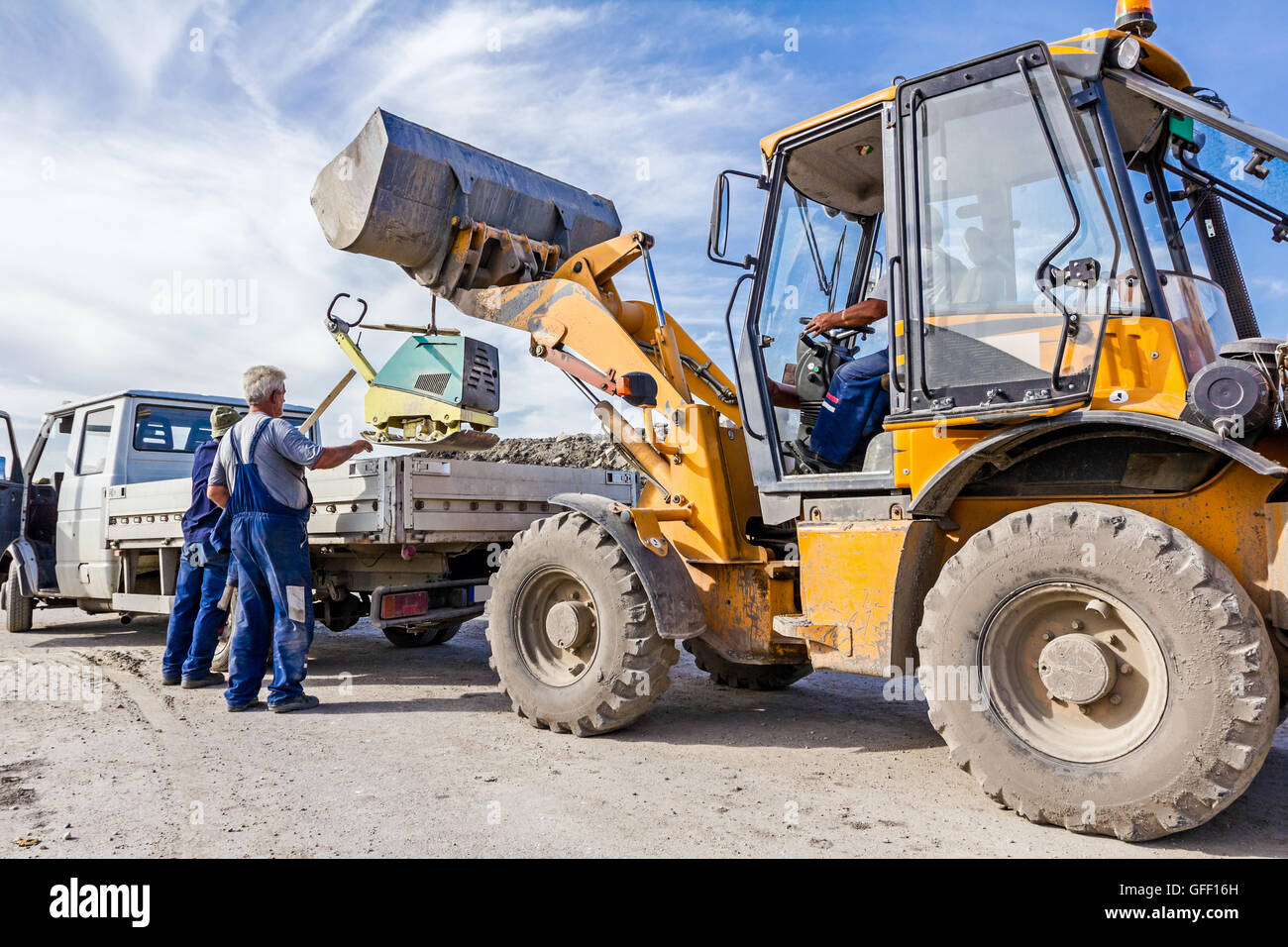 Digger with raised loader bucket hi-res stock photography and images ...