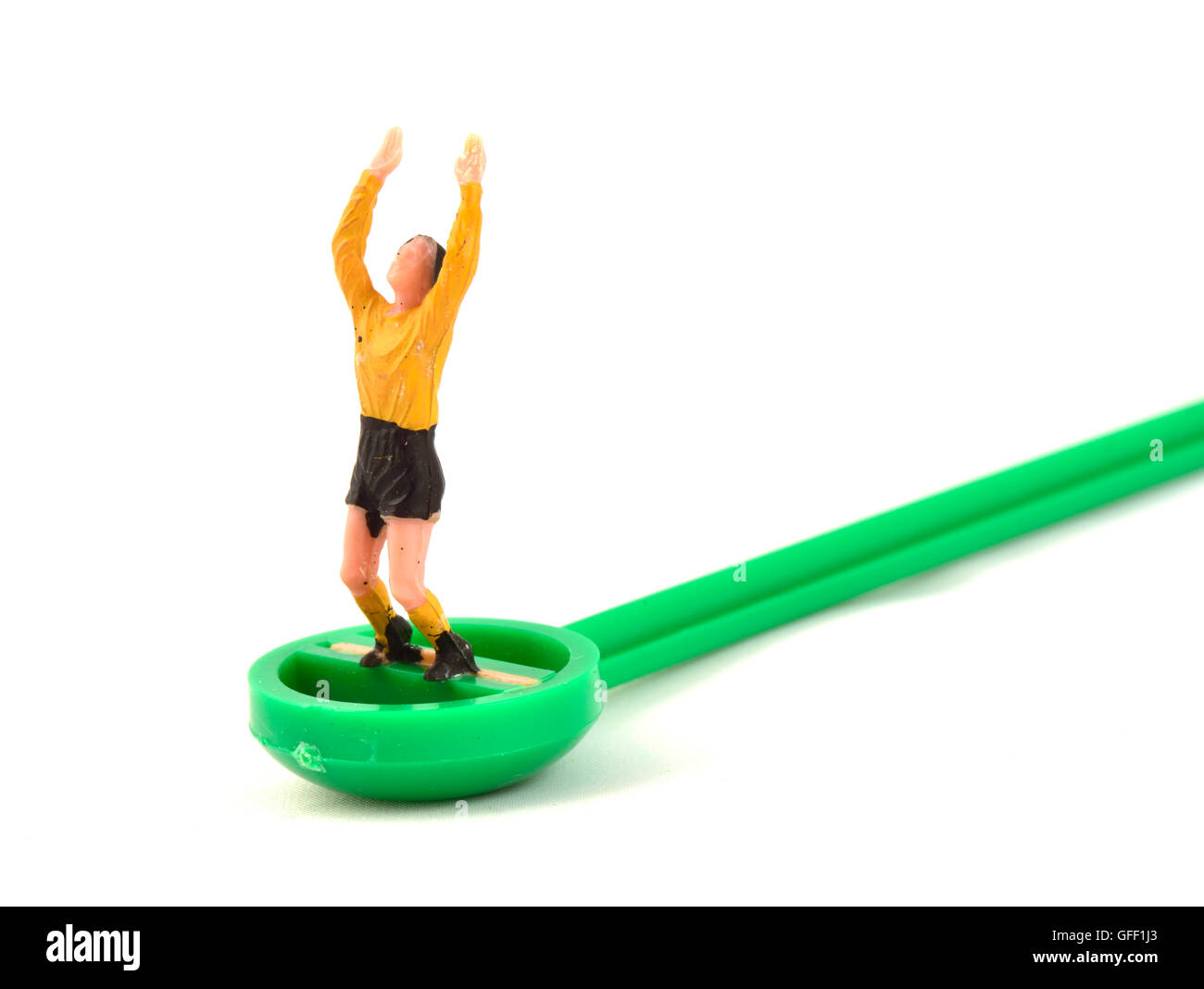 Yellow shirted Subbuteo goalkeeper on the second generation plastic ...