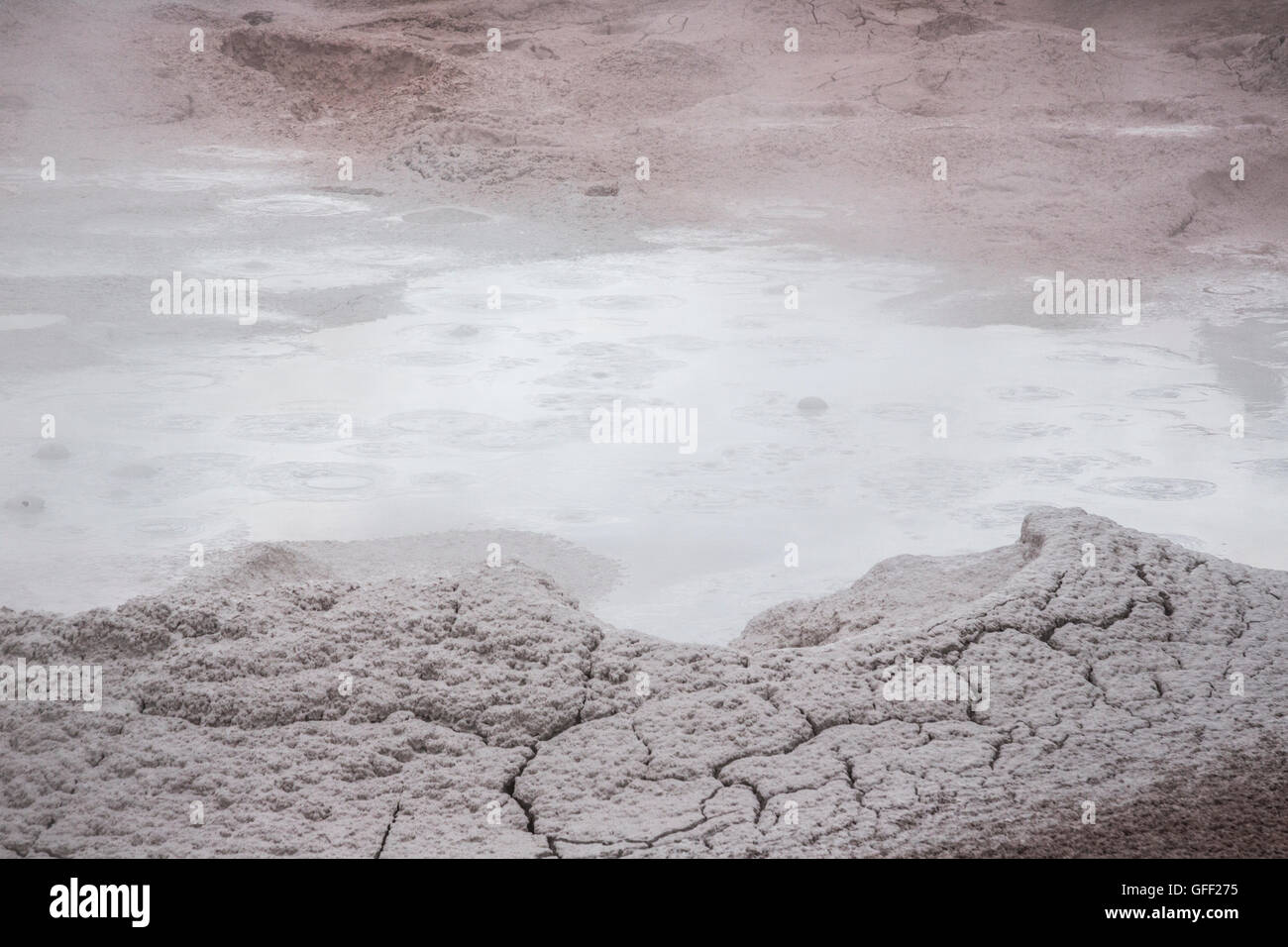 Cracked earth surface of a geyser in Yellowstone National Park USA ...