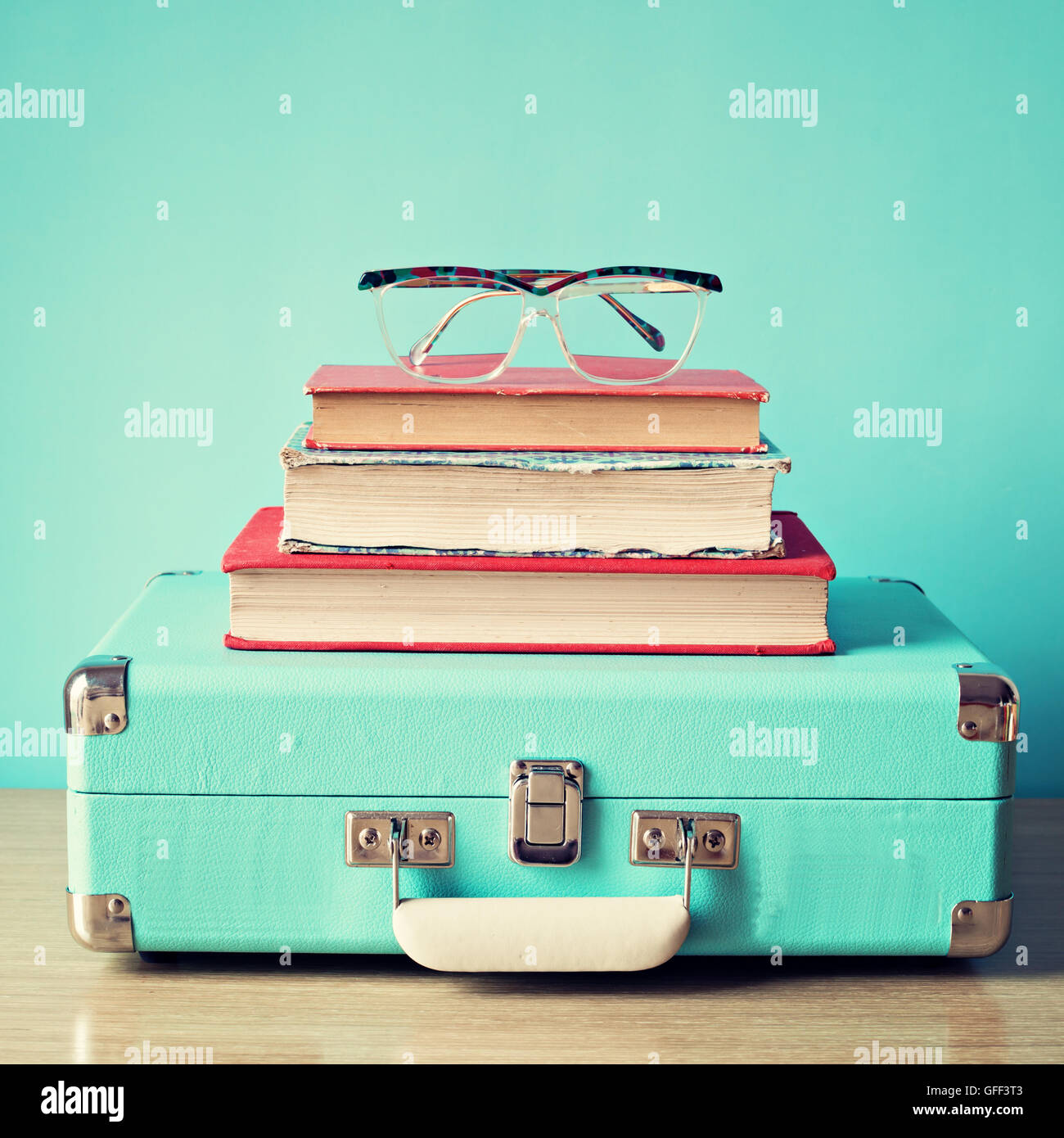 Vintage eyeglasses over books and briefcase Stock Photo - Alamy