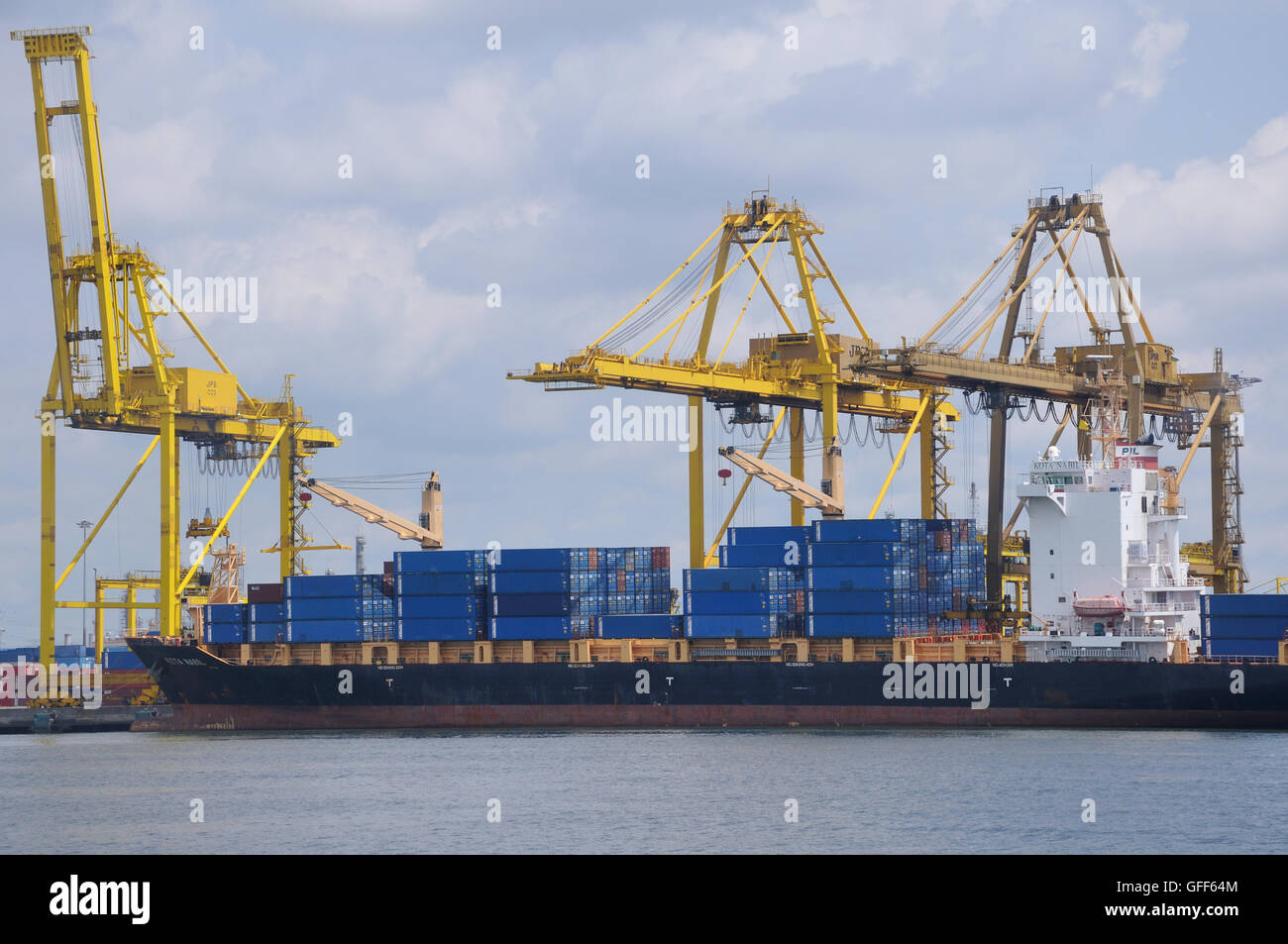 Loading a Container Ship in Johor, Malaysia Stock Photo - Alamy