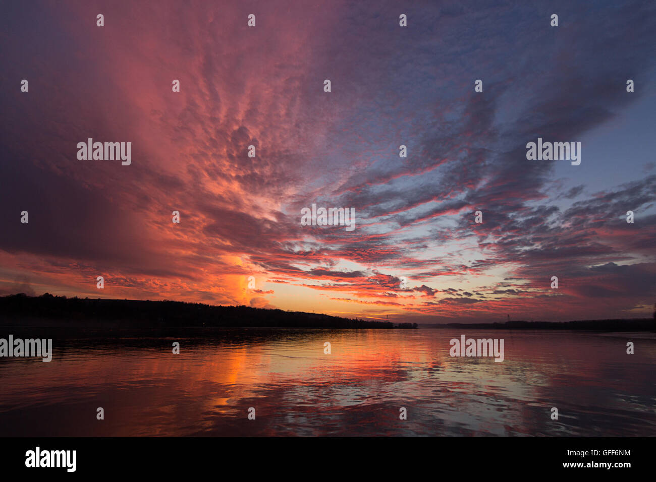 Dramatic Sunset sky reflection Stock Photo - Alamy