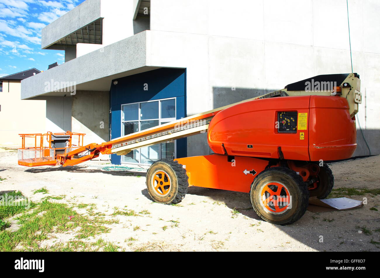 Elevated cherry picker on job site Stock Photo - Alamy