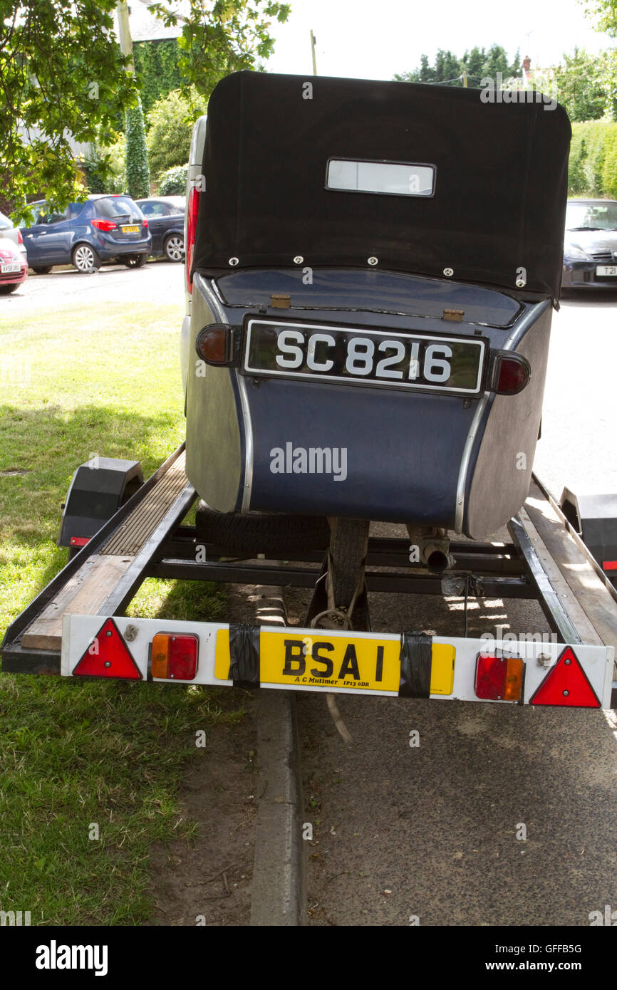 A 1930s three wheeled BSA light car on a trailer with the very ...