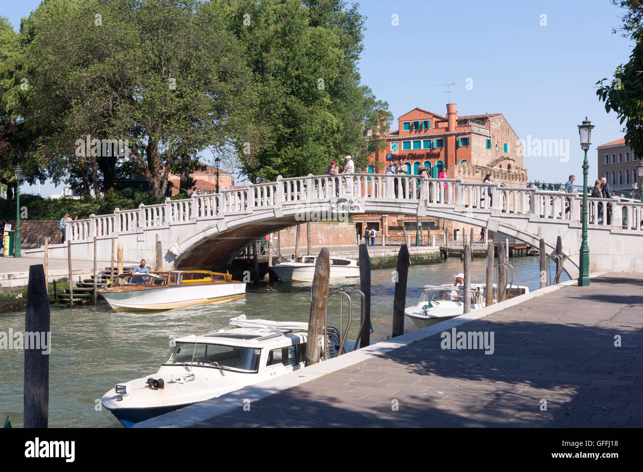 Tourists crossing the Ponte Papadopoli in Venice - one of two bridges ...