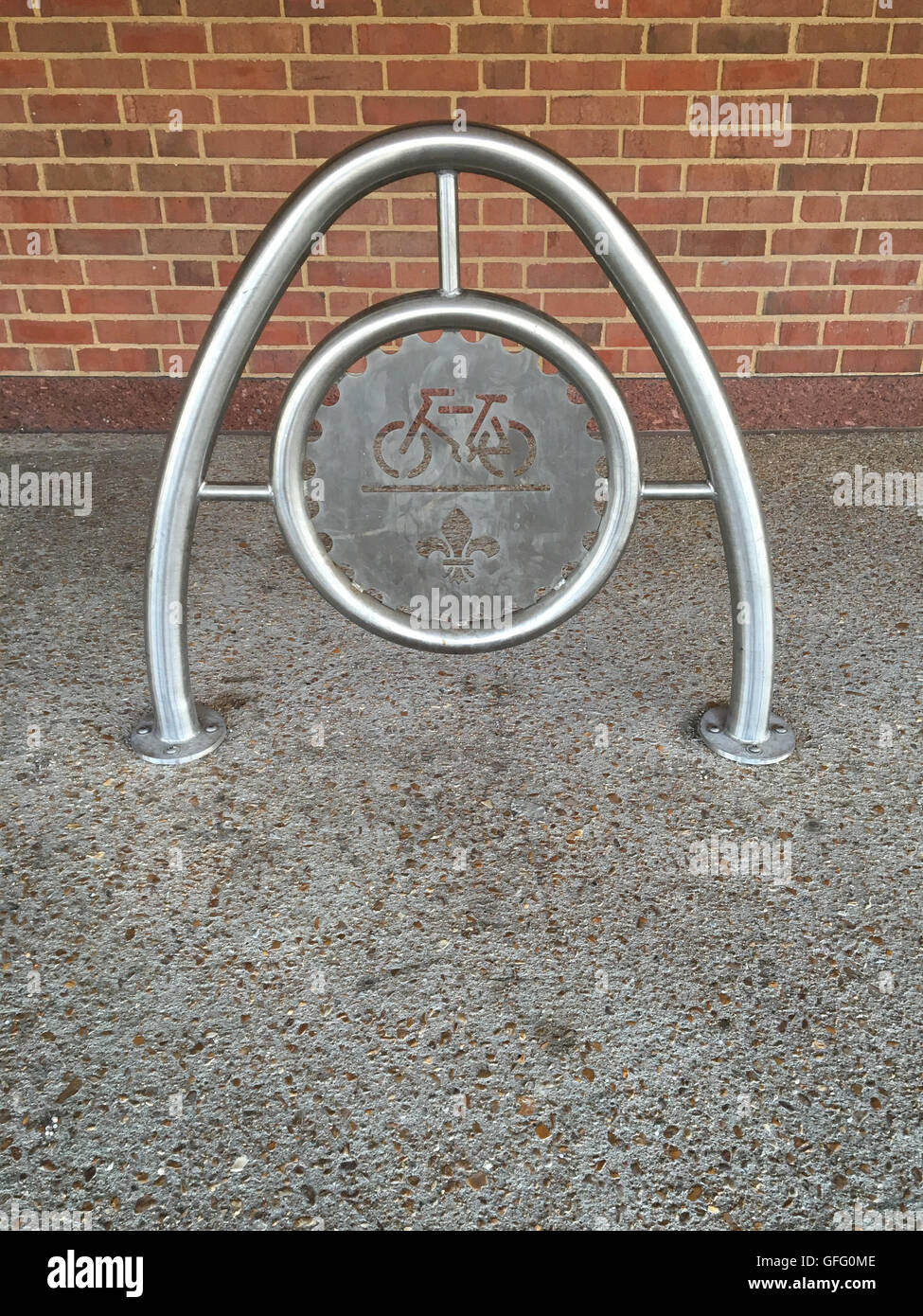 Stainless steel bike rack on a sidewalk by a brick wall Stock Photo - Alamy