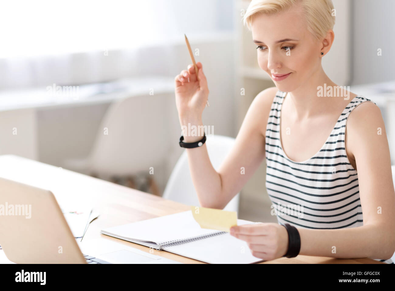 Woman working at the table Stock Photo - Alamy