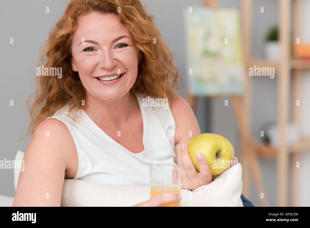 Cheerful woman resting at home Stock Photo - Alamy