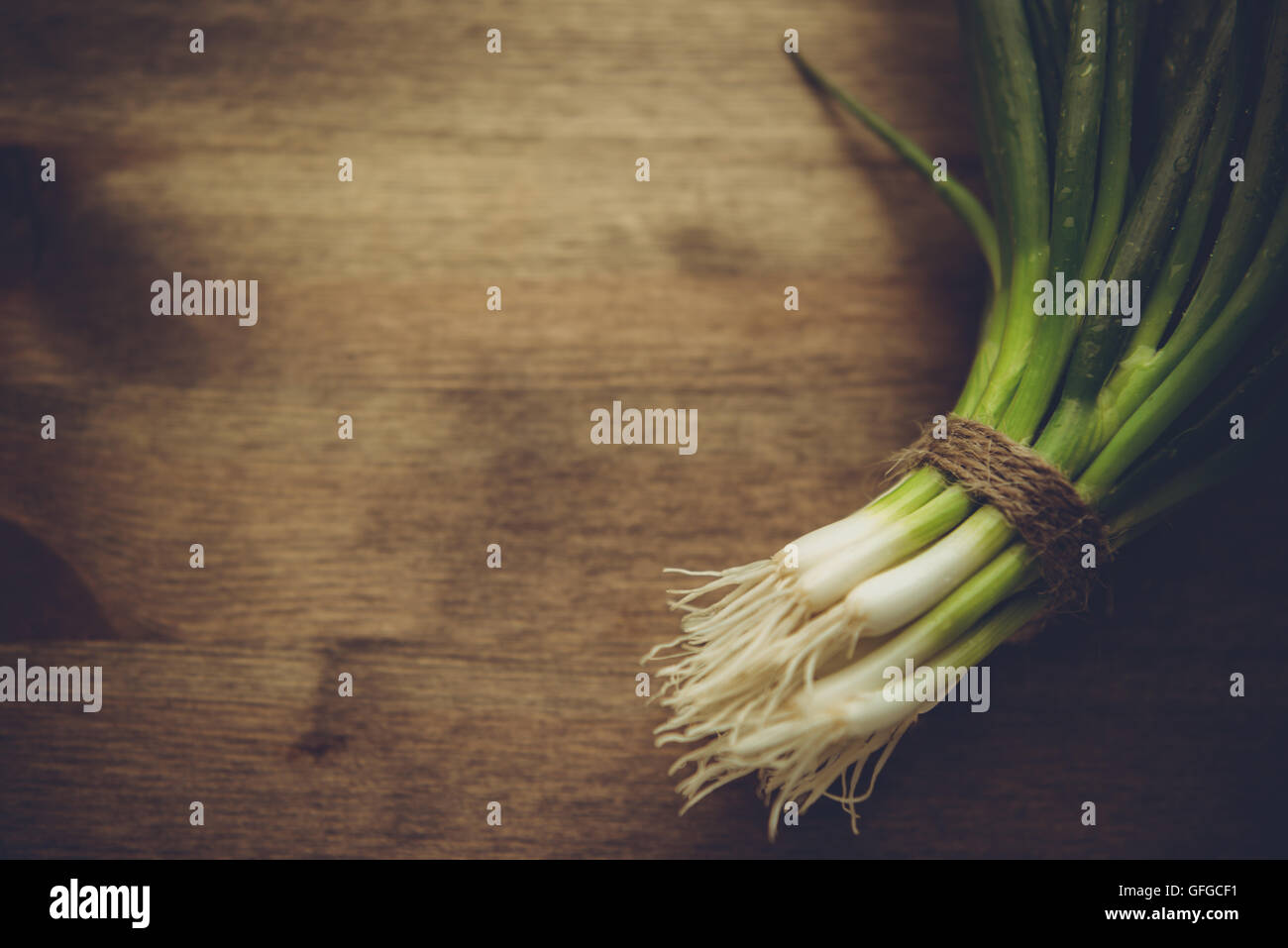 A bunch of fresh spring onions shot on studio surface Stock Photo - Alamy