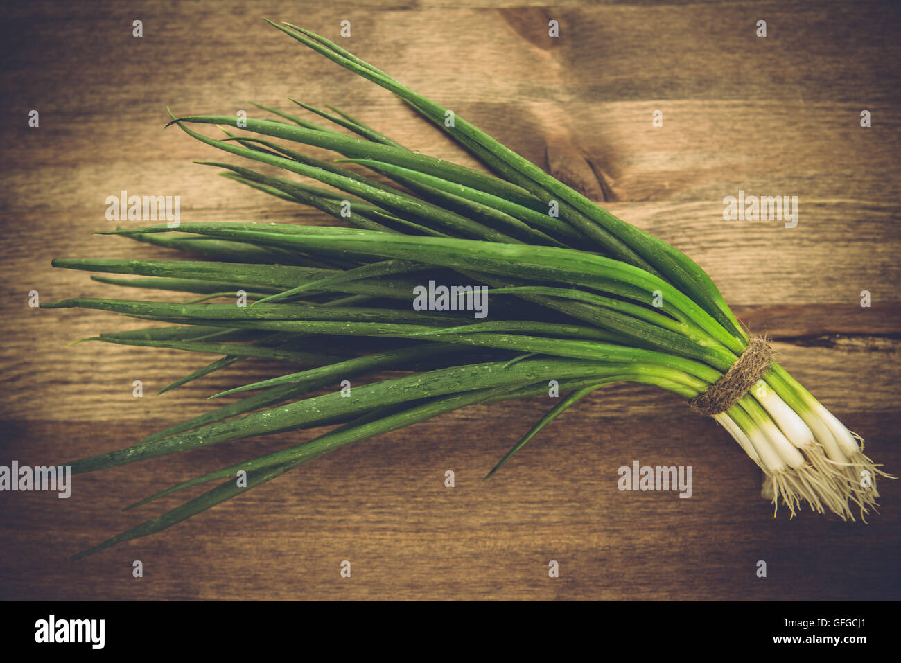 A bunch of fresh spring onions shot on studio surface Stock Photo - Alamy