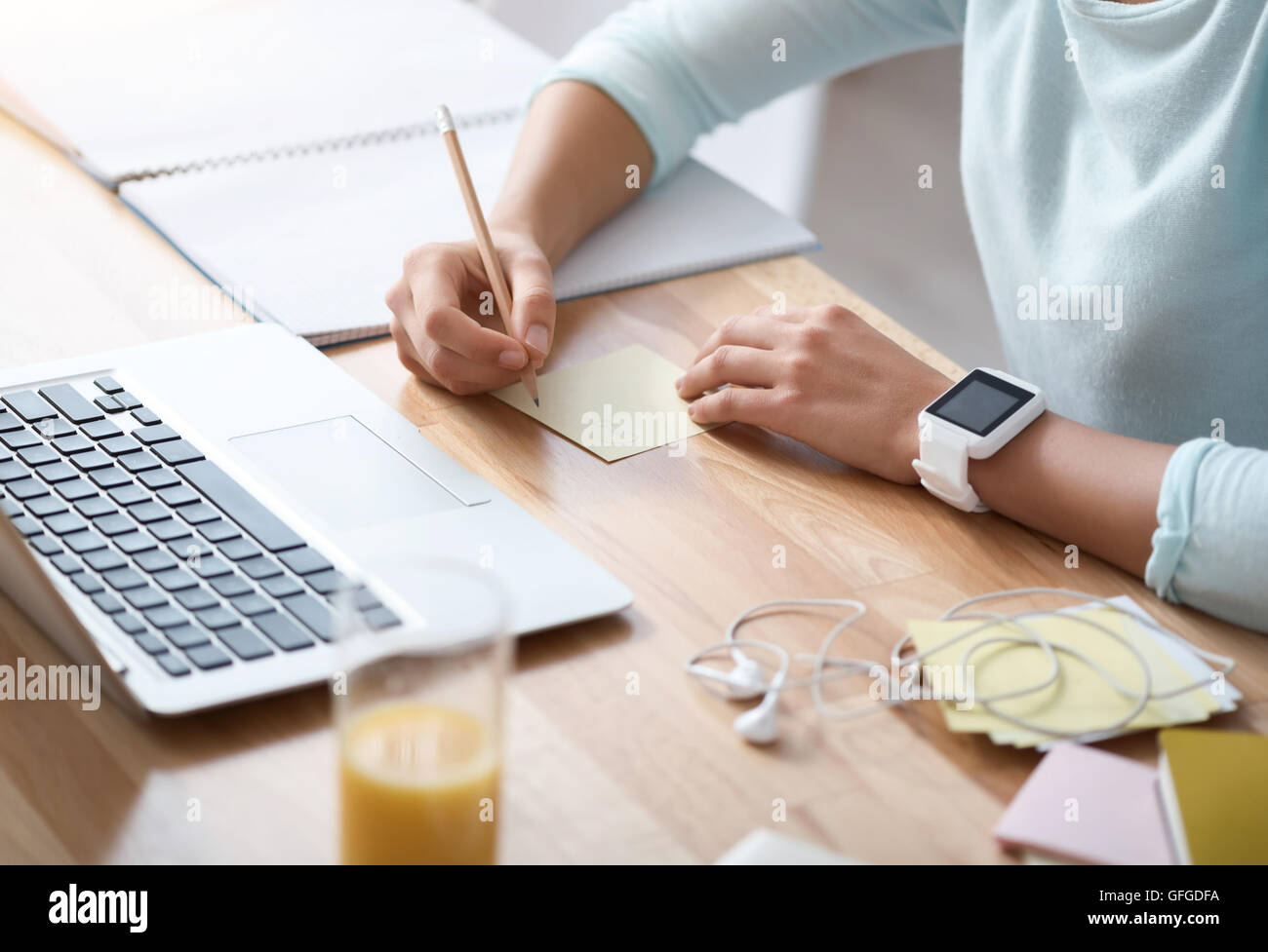 Pleasant woman making notes Stock Photo - Alamy