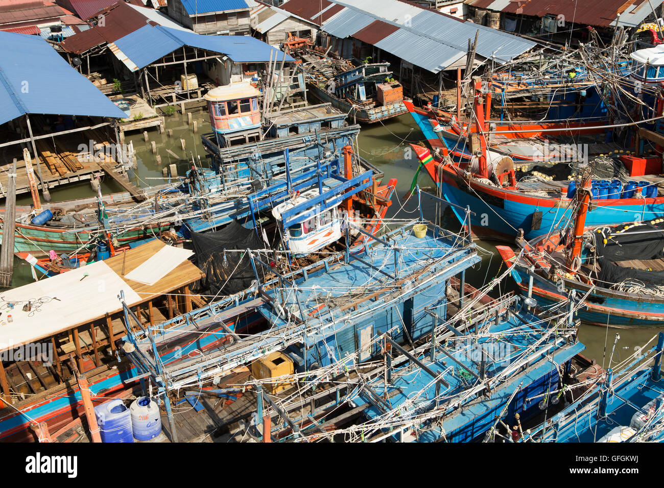 Crowded part of the river. Traditional fishing boats in various states ...